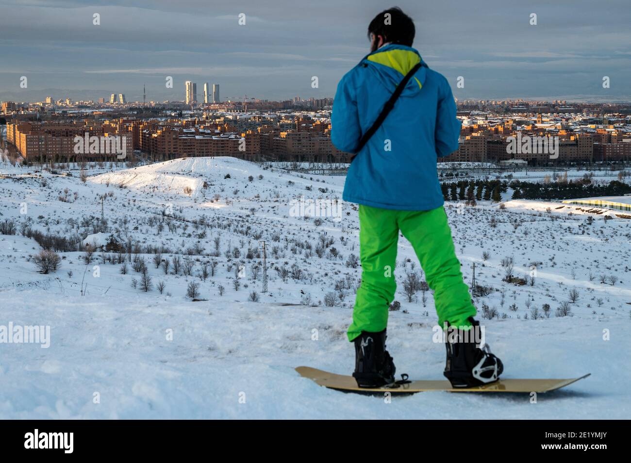 Madrid, Spain. 10th Jan, 2021. A man snowboarding in a neighborhood of ...