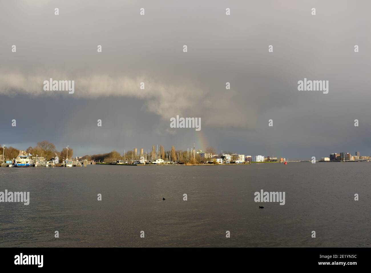 A beautiful little rainbow above Amsterdam Noord as seen from the river ...