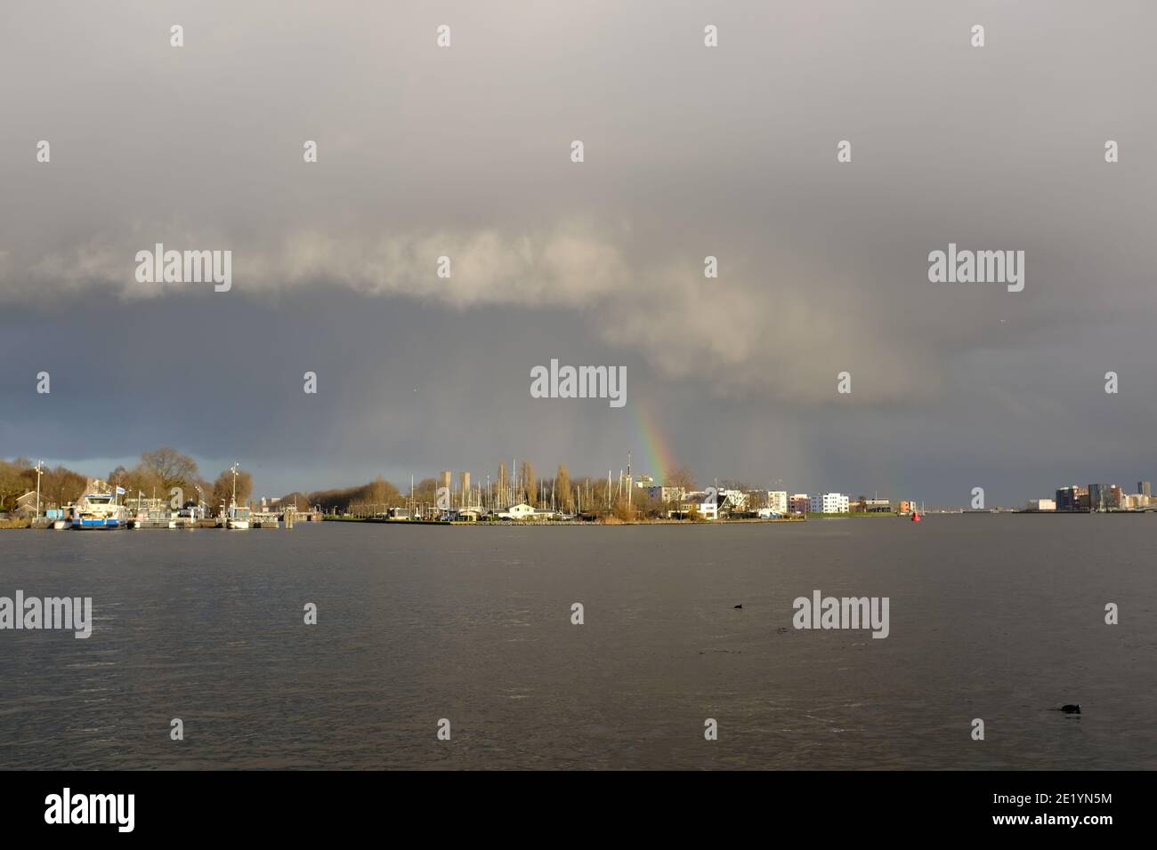 A beautiful little rainbow above Amsterdam Noord as seen from the river ...