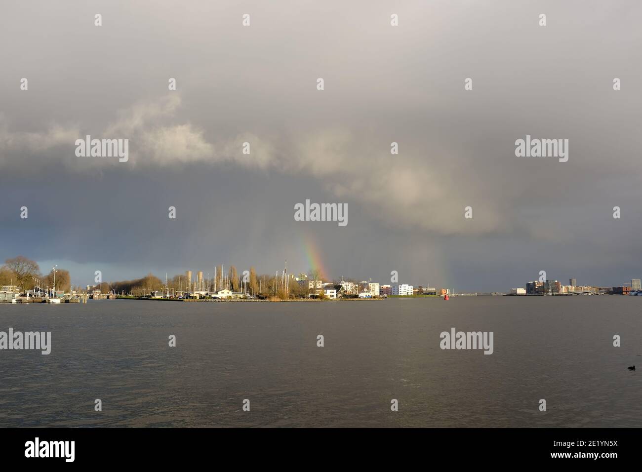 A beautiful little rainbow above Amsterdam Noord as seen from the river ...