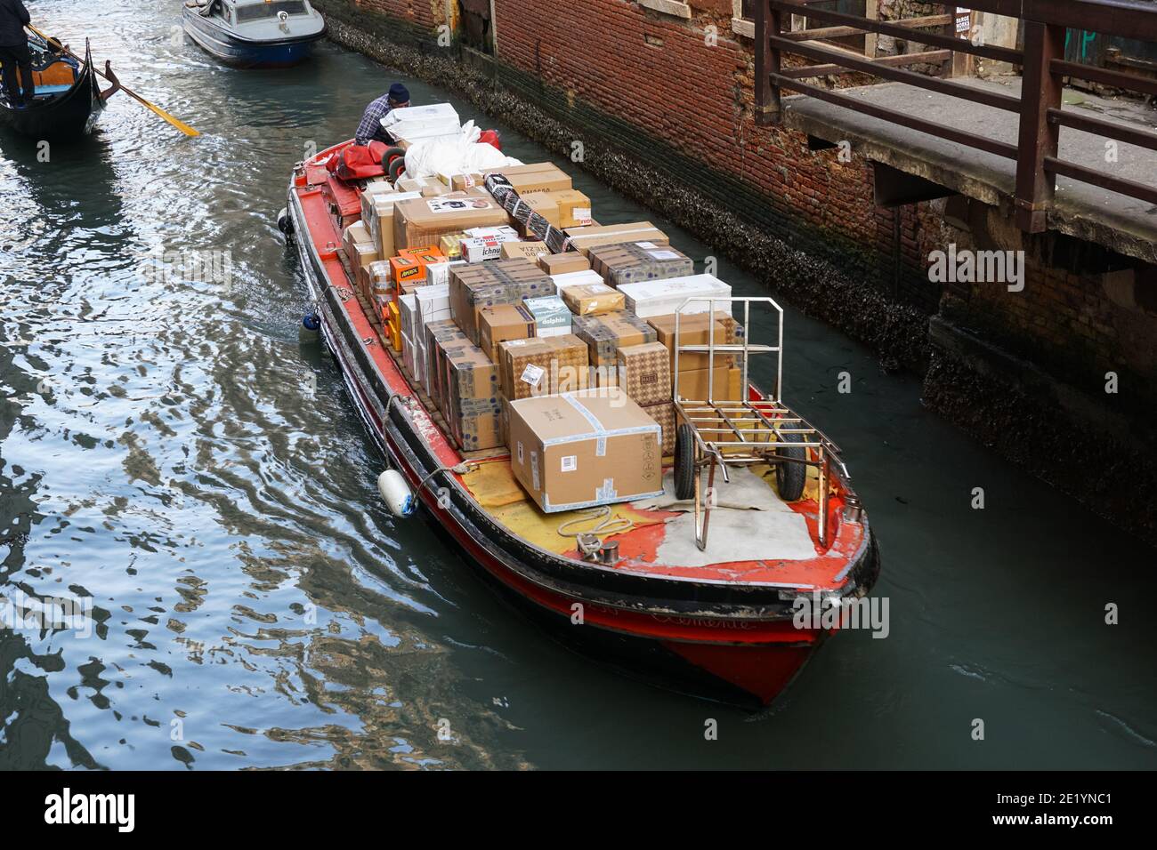 Cargo boat, cargo ship on a canal in Venice, Italy Stock Photo - Alamy
