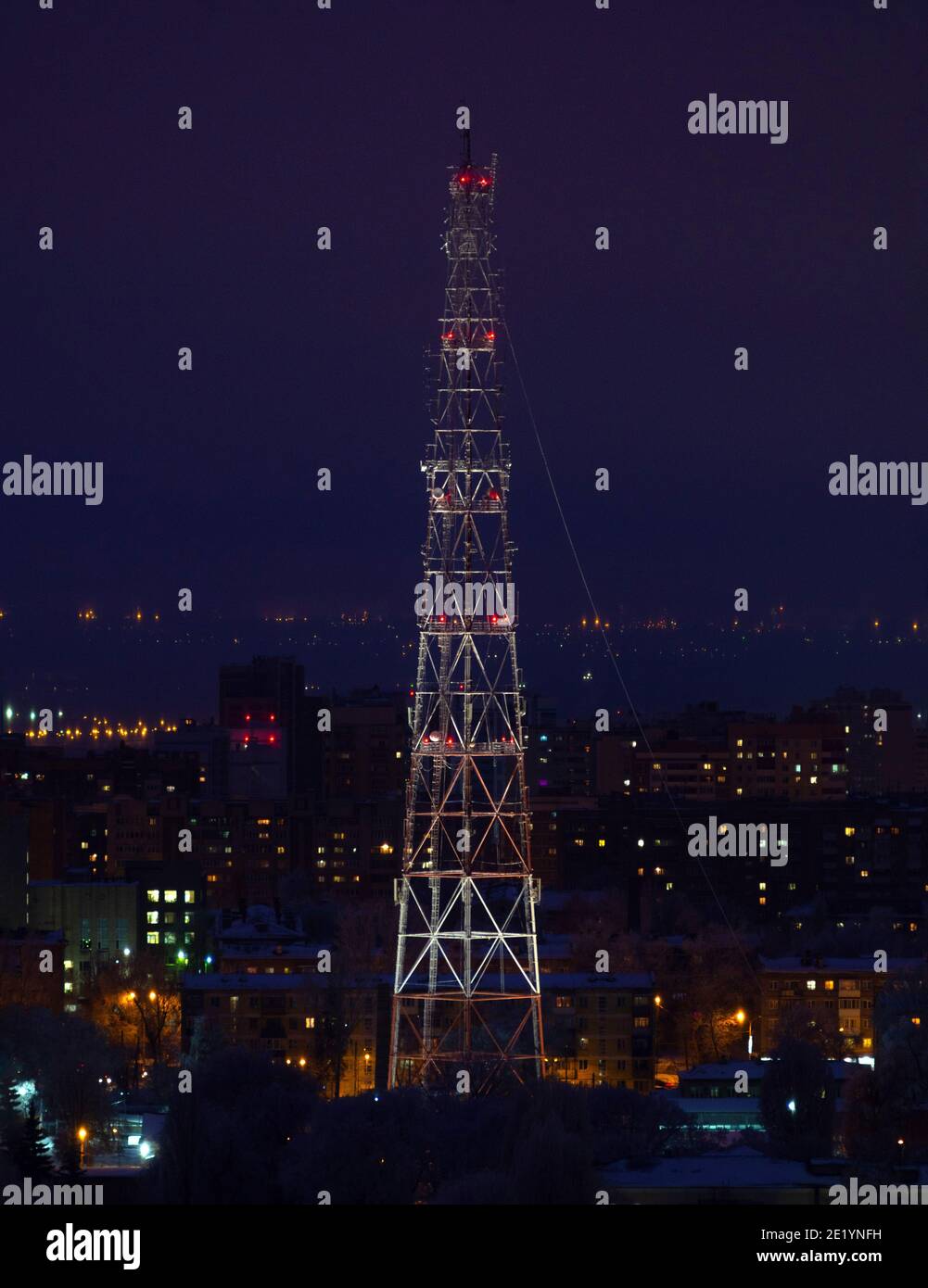 Telecom communication tower in city night view Stock Photo - Alamy