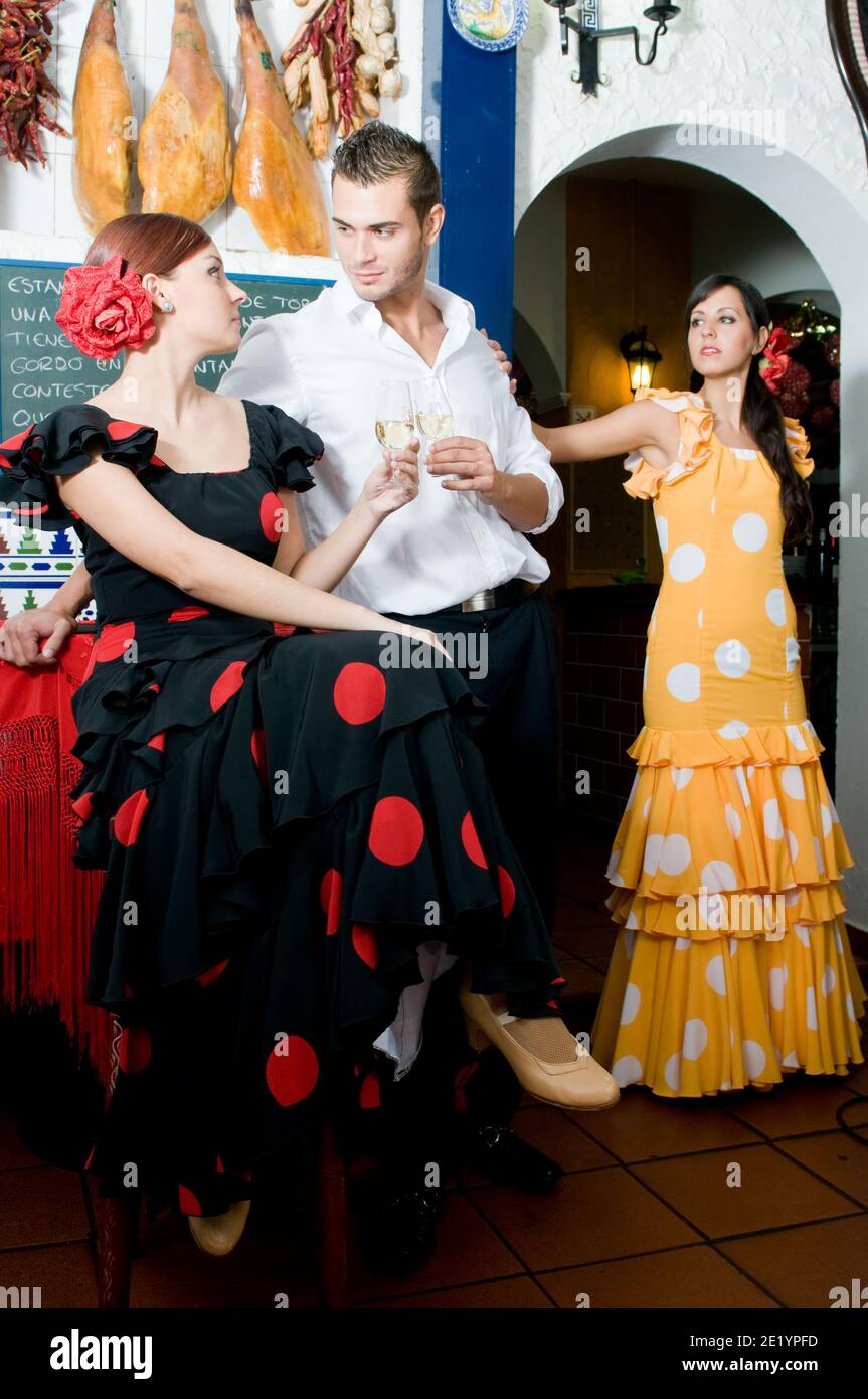 Spanish flamenco dancers during the Seville fair dancing sevillanas ...