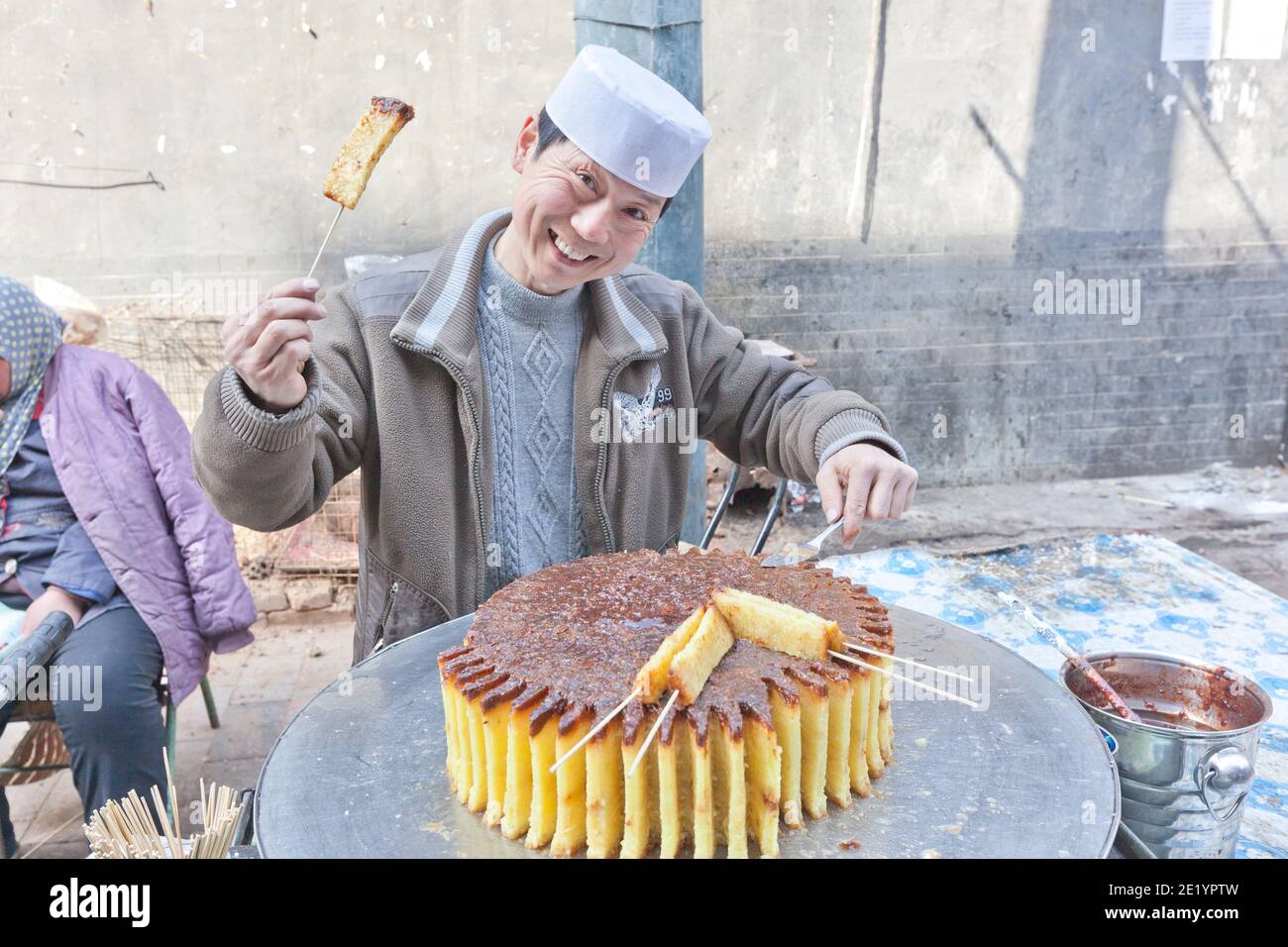 Smiling vendor offering hi-res stock photography and images - Alamy