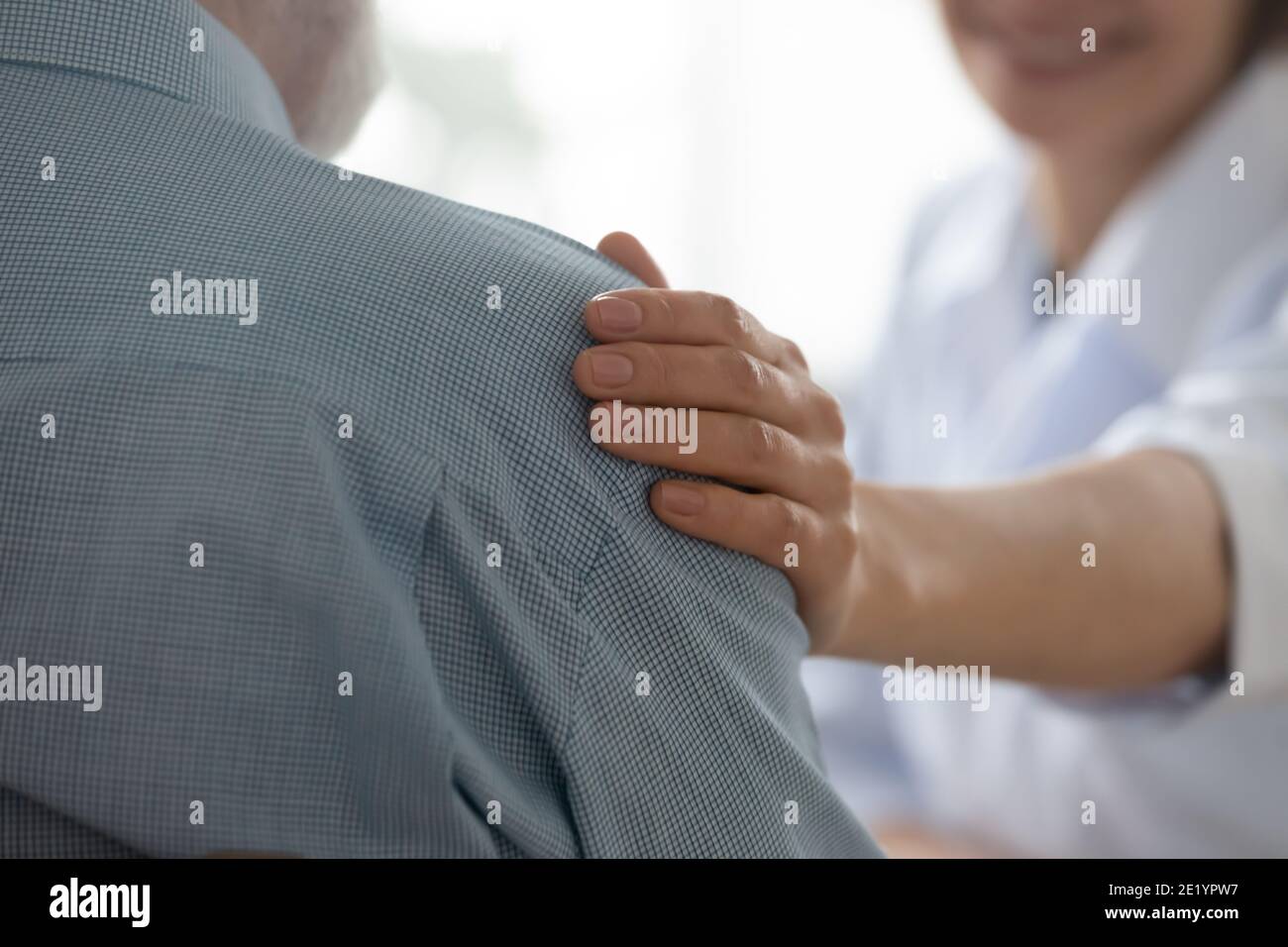 Man shoulder putting hand hi-res stock photography and images - Alamy
