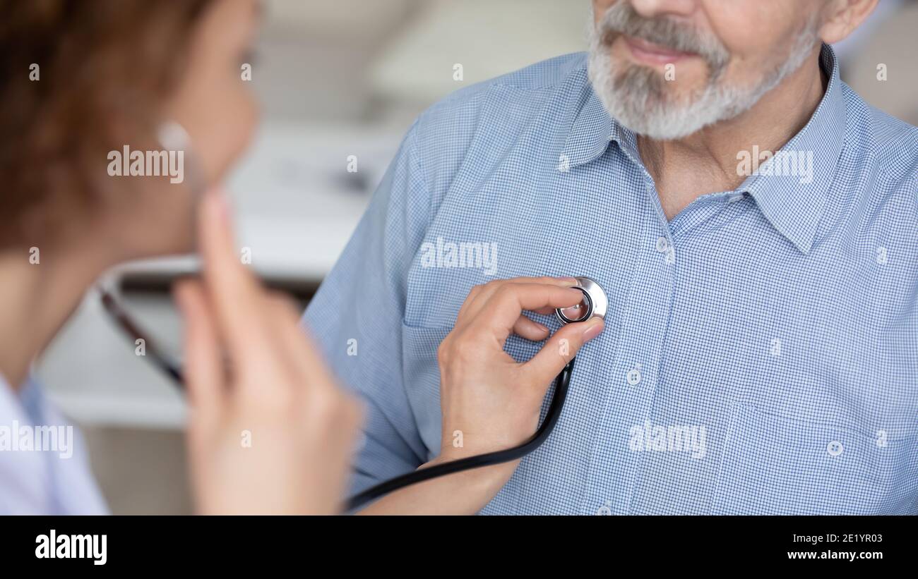 Doctor using stethoscope listen middle hi-res stock photography and ...