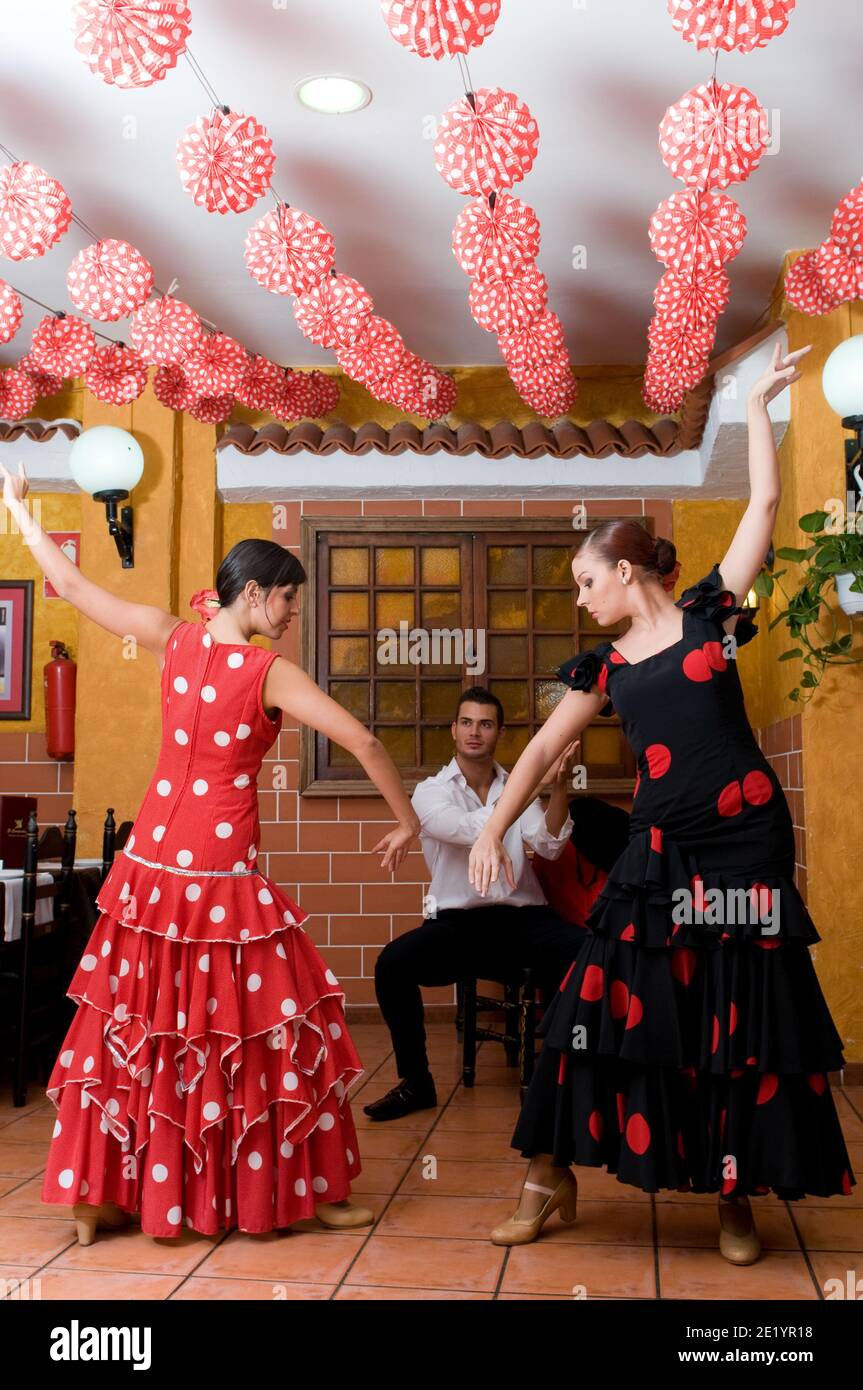 Spanish flamenco dancers during the Seville fair dancing sevillanas ...