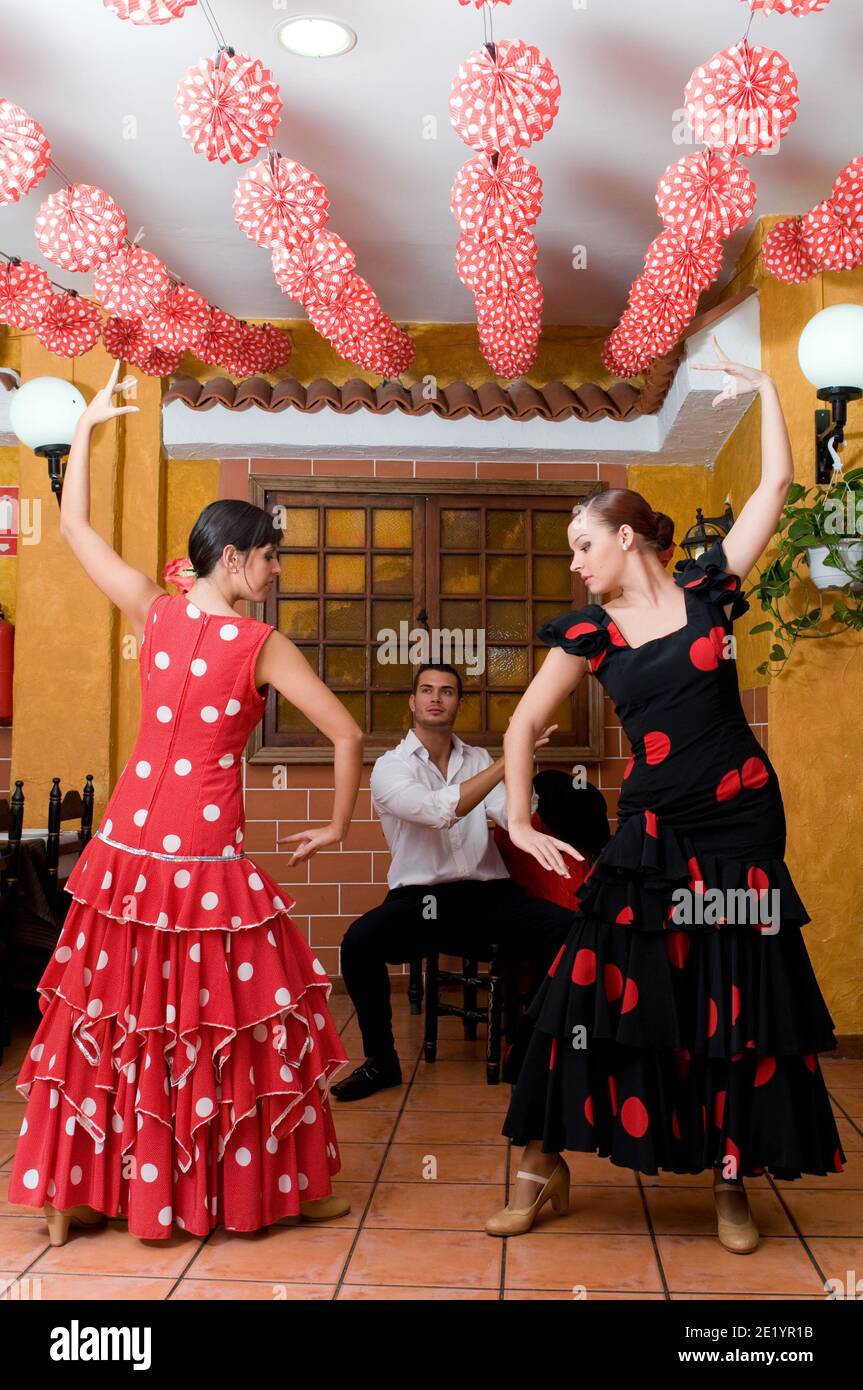 Spanish flamenco dancers during the Seville fair dancing sevillanas ...