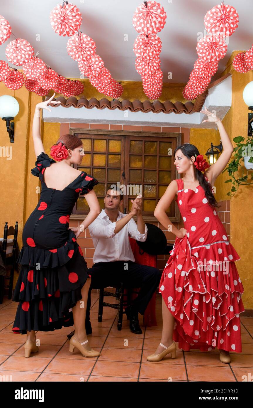 Spanish flamenco dancers during the Seville fair dancing sevillanas ...