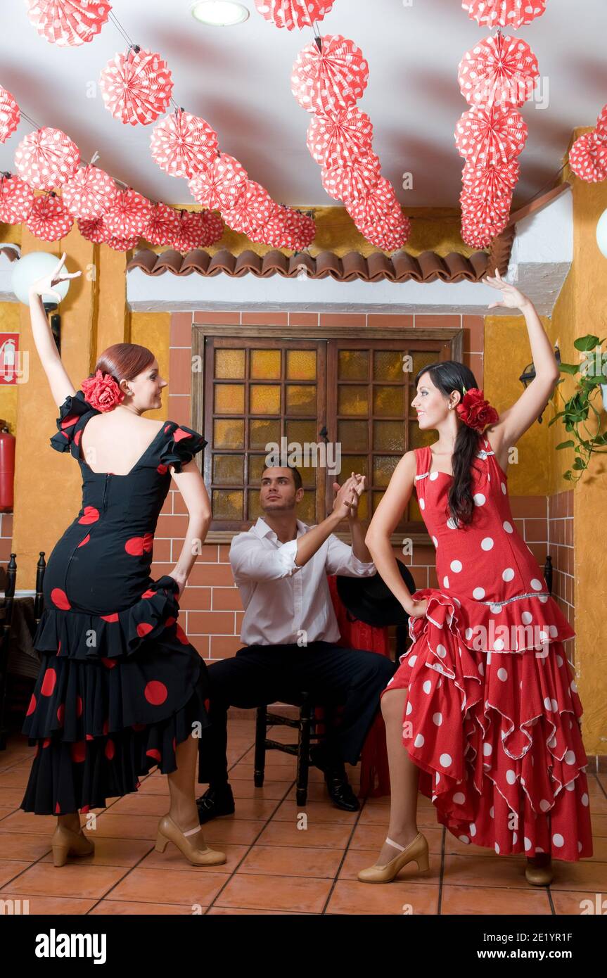 Spanish flamenco dancers during the Seville fair dancing sevillanas ...