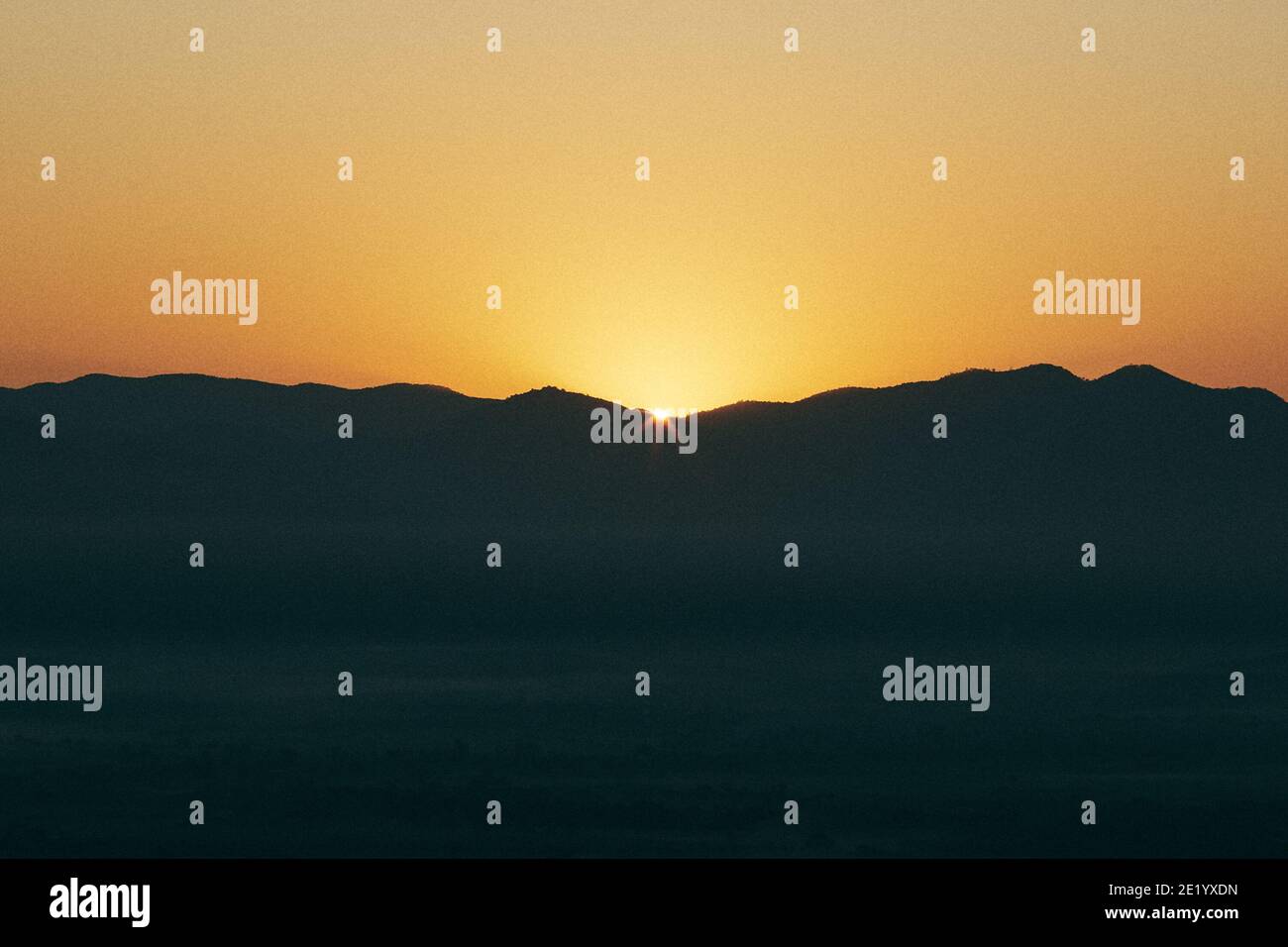 Rising sun on the ridge Stock Photo - Alamy