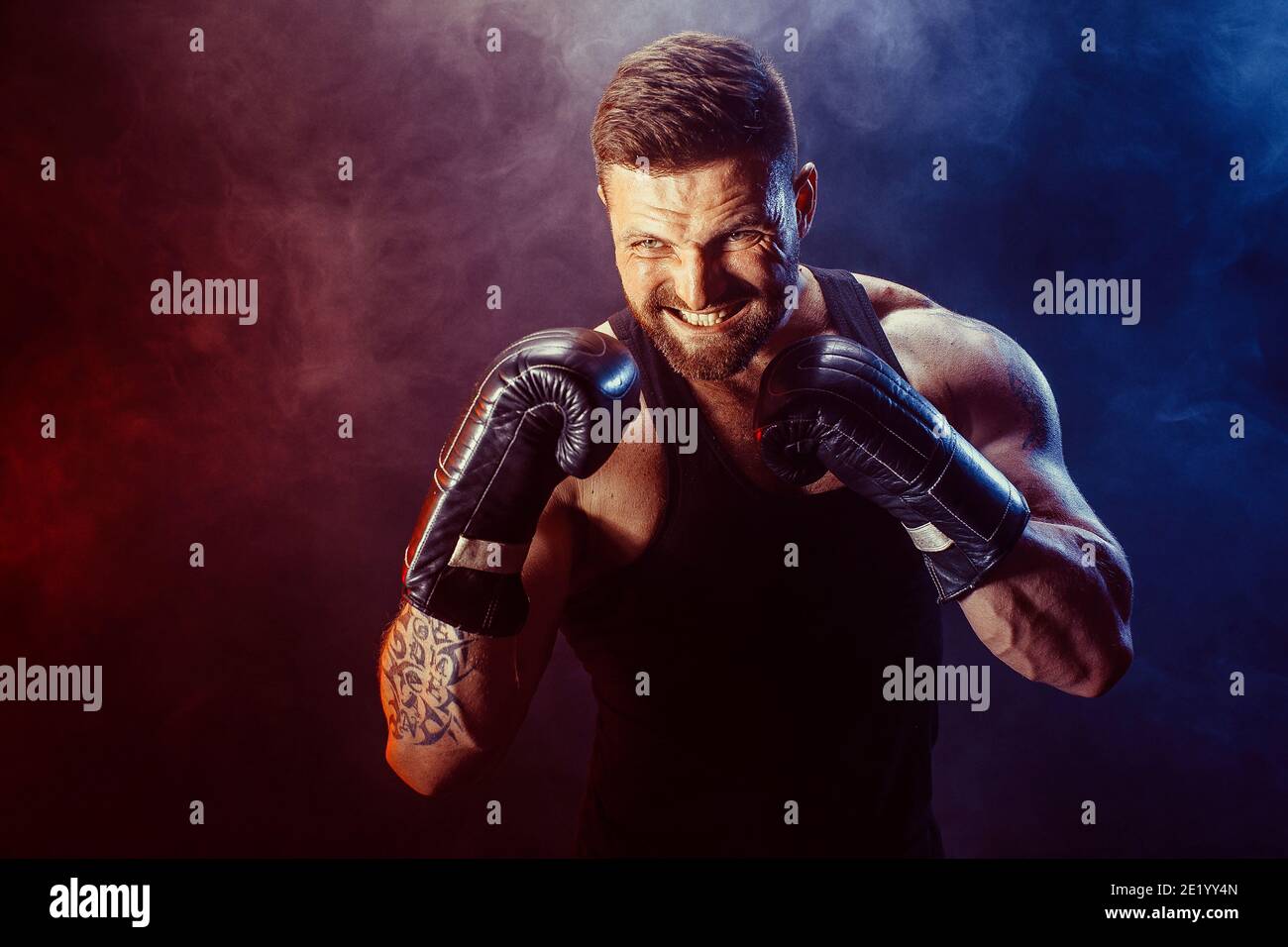 Sportsman boxer fighting on black background with shadow. Copy Space ...