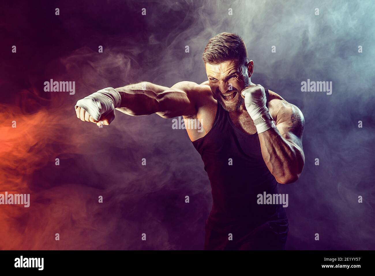 Sportsman boxer fighting on black background with shadow. Copy Space ...