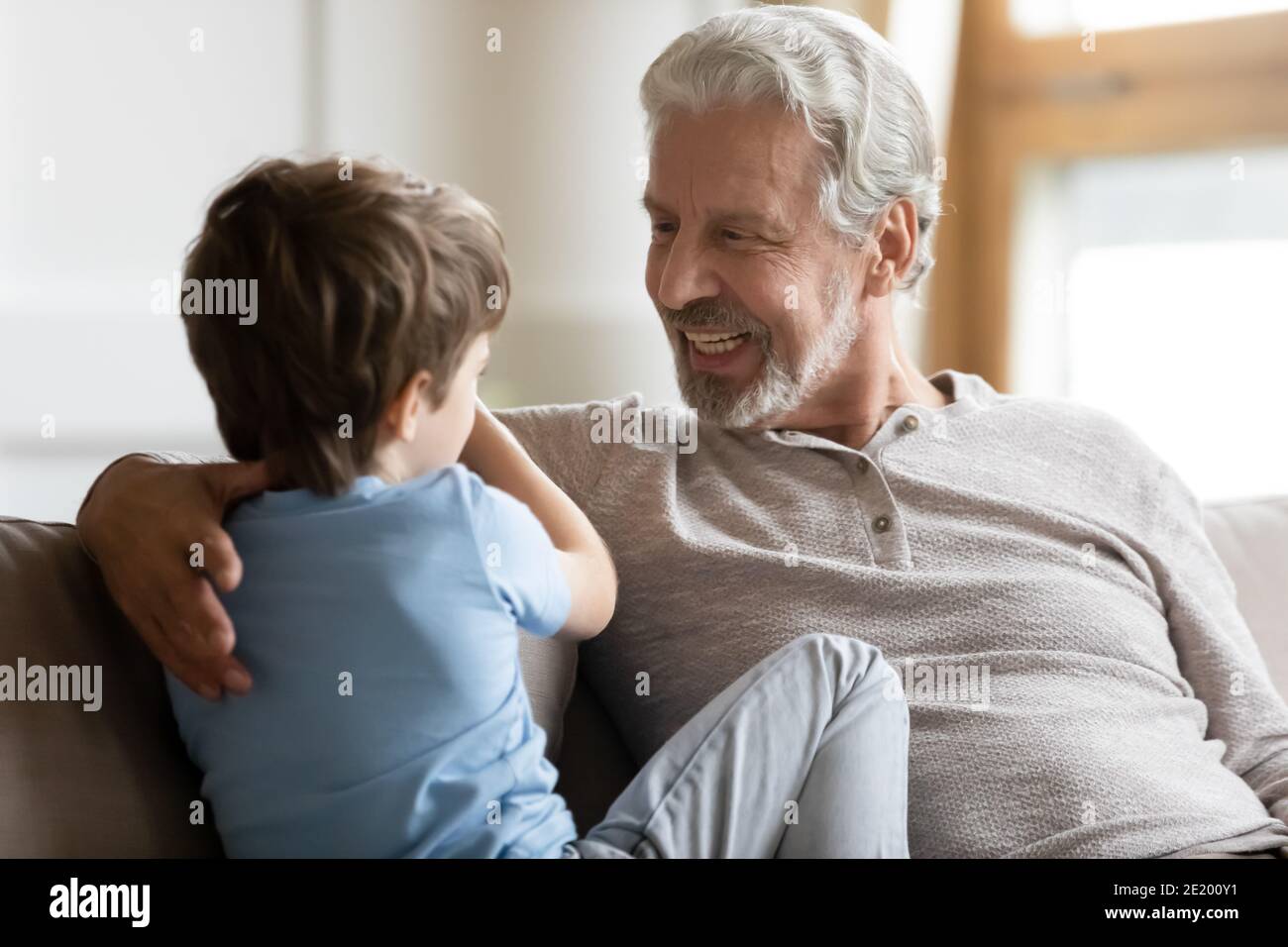 Happy old grandfather talk chat with small grandson Stock Photo - Alamy