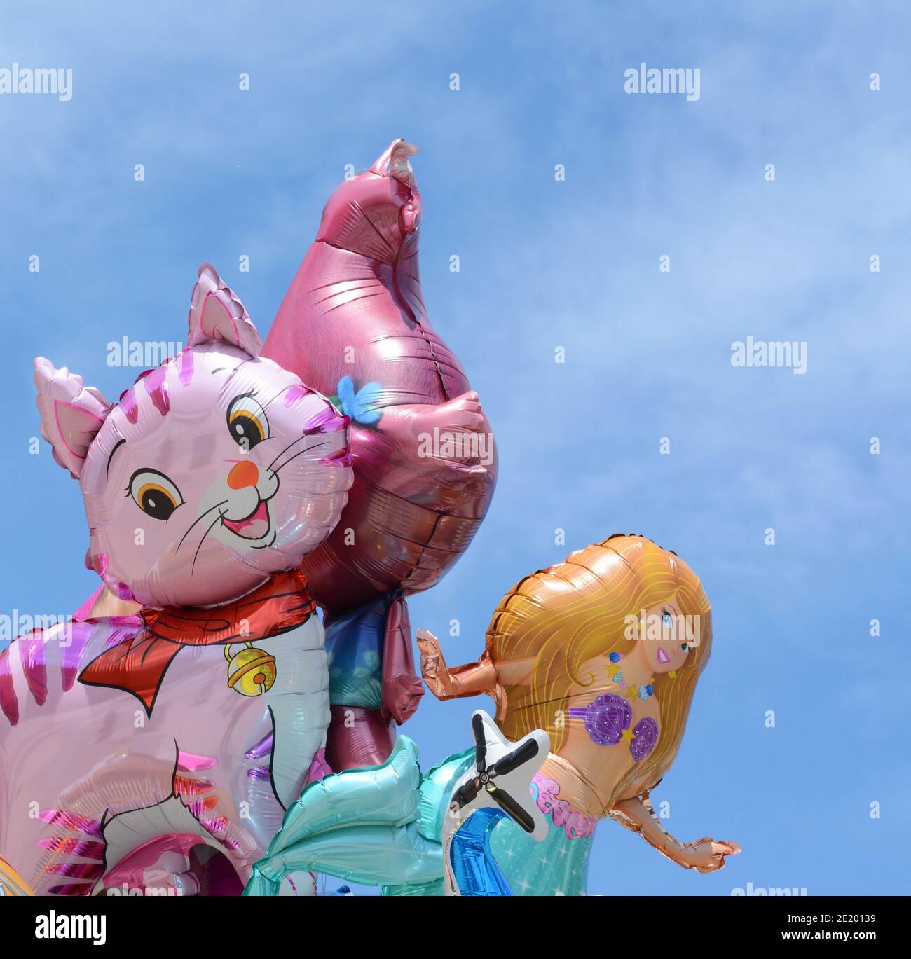 Fair. Balloons for kids with the shapes of cartoon characters Stock ...