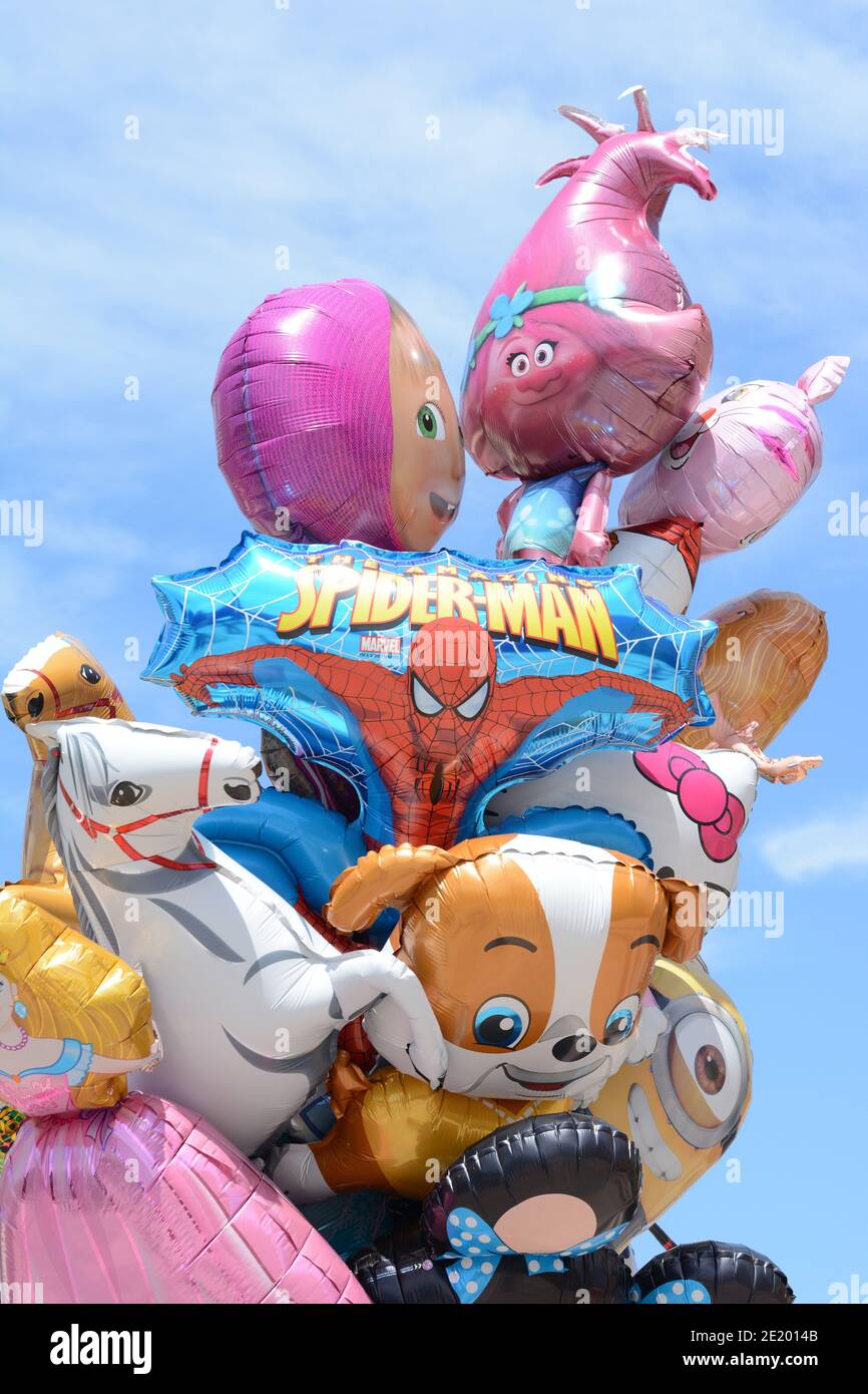 Fair. Balloons for kids with the shapes of cartoon characters Stock ...