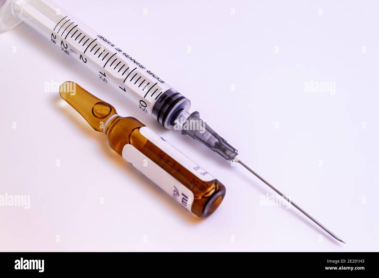 Syringe and a medication vial on a white background Stock Photo - Alamy