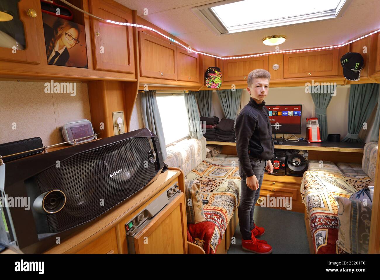 Young boy standing inside caravan Stock Photo - Alamy