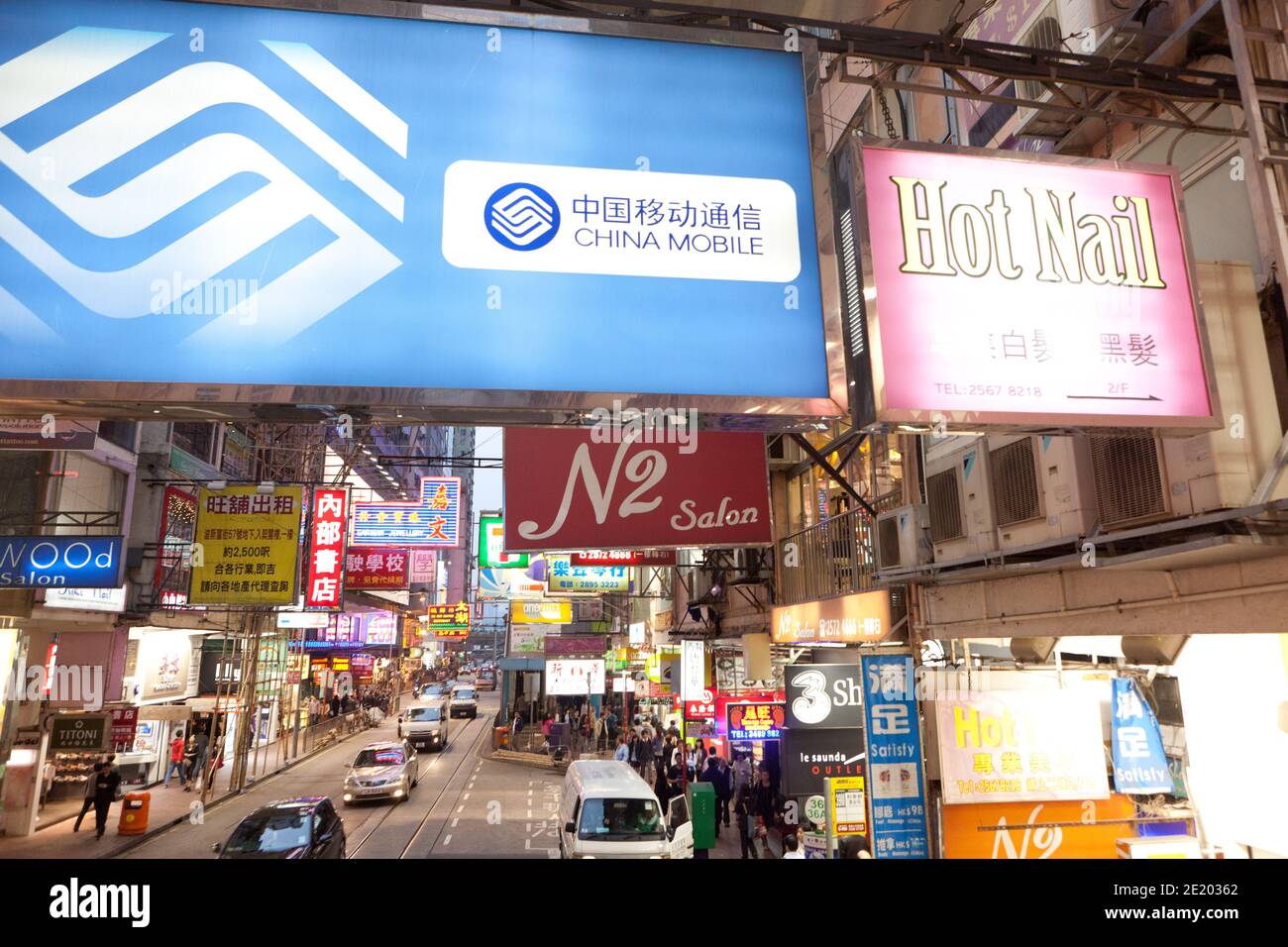 Hanging Signs on a Busy Street Stock Photo - Alamy