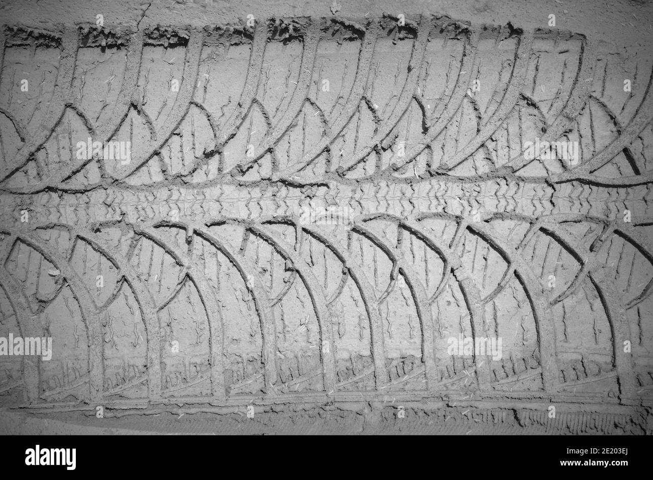 Wheel track on mud. abstract wheel trail background Stock Photo - Alamy