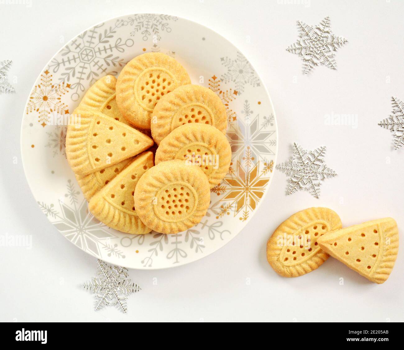 All butter shortbread biscuits on white plate with decorative ...