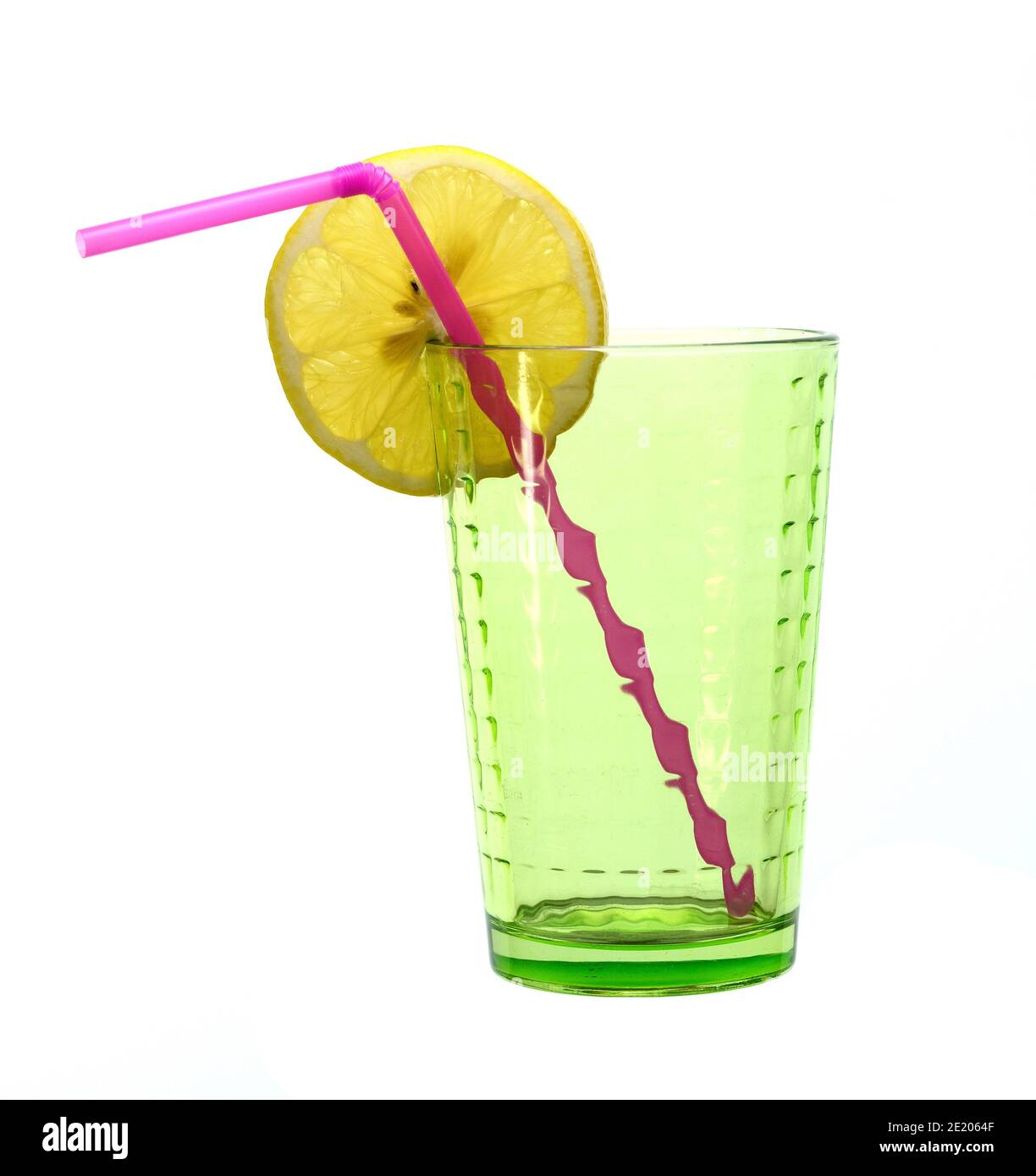 Empty transparent green glass with lemon slice isolated on white ...