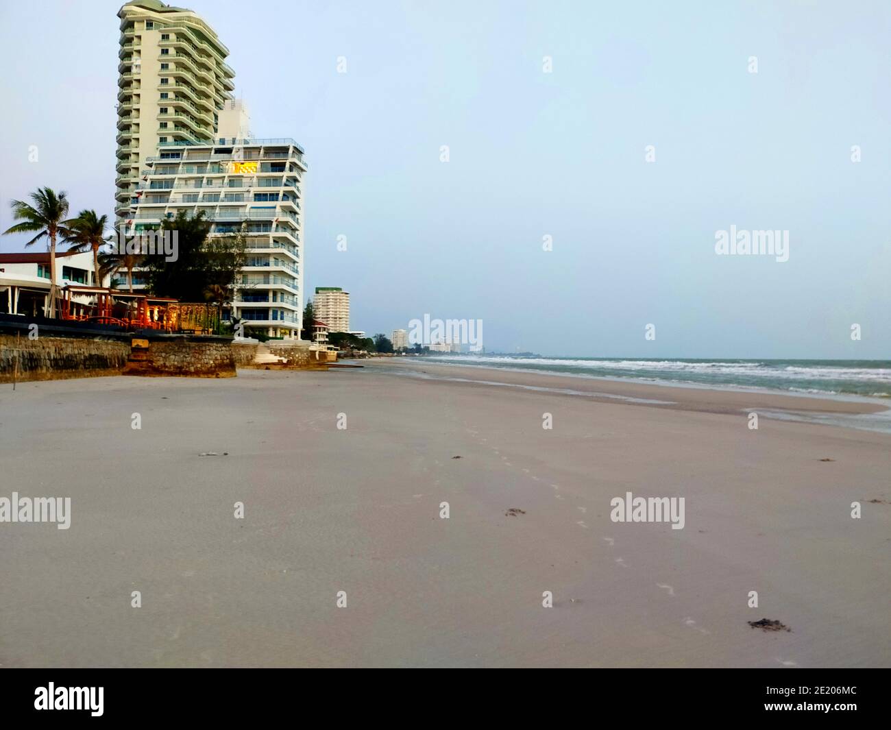 Resorts on long sand beach Stock Photo - Alamy