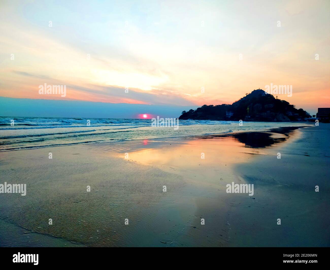 Sea waves overwhelming long sand beach in early morning Stock Photo - Alamy