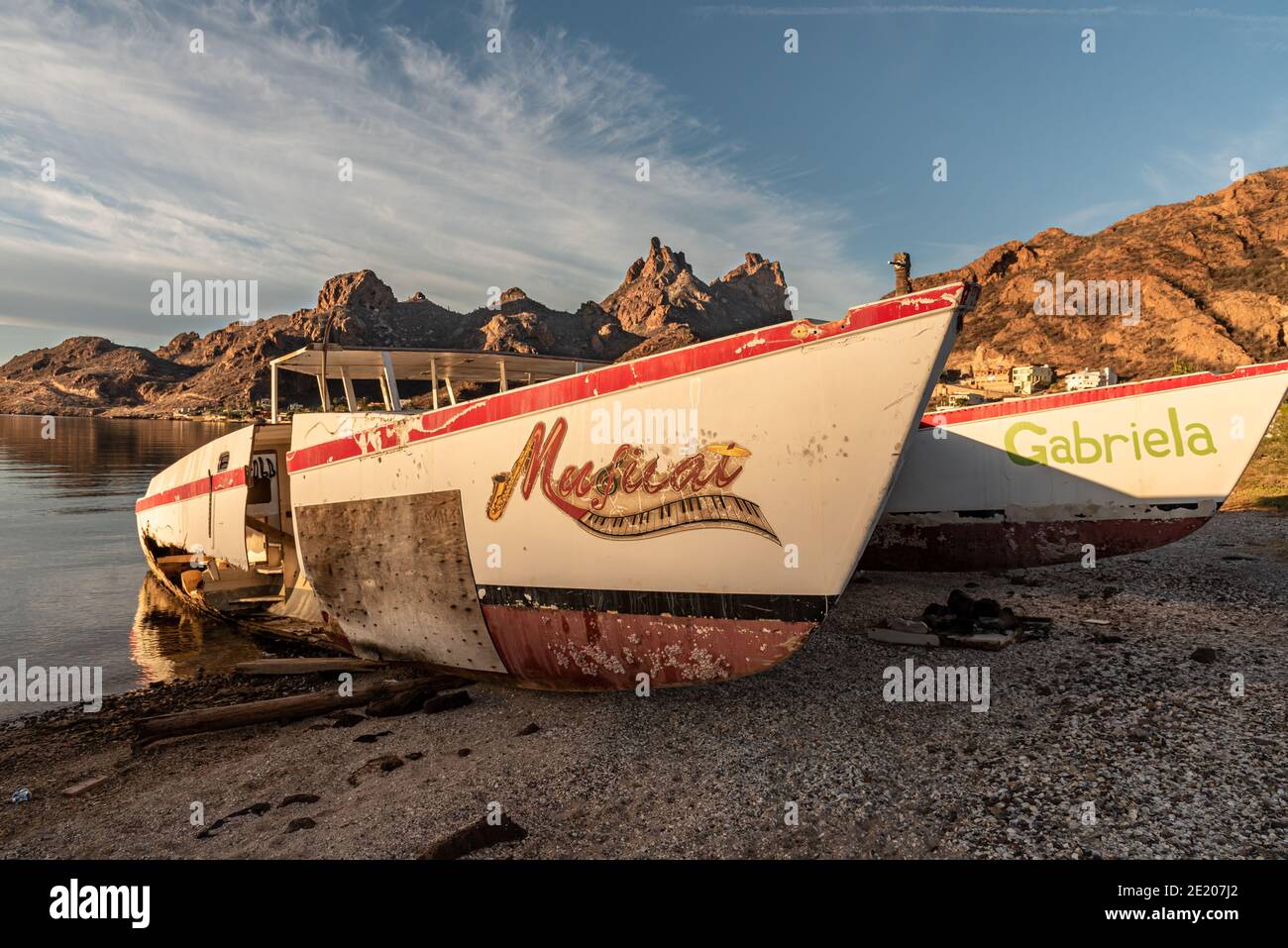 A shipwrecked catamaran on the beach Stock Photo - Alamy