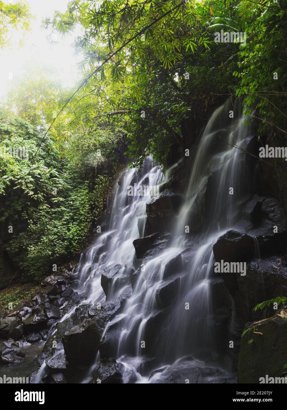 Long exposure panorama of tropical Air Terjun Kanto Lampo waterfall ...