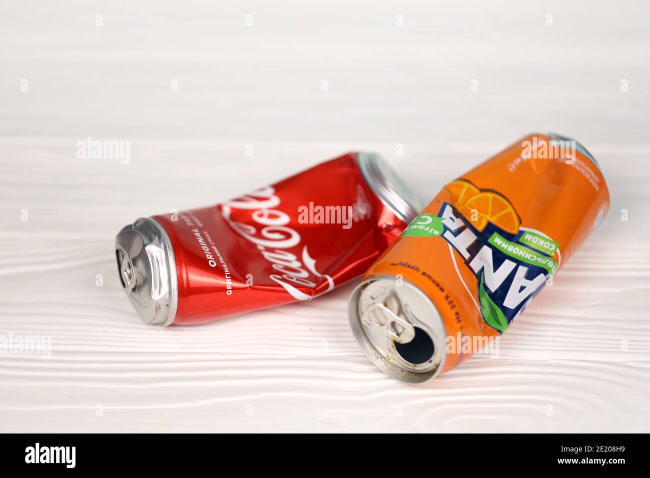 KHARKOV, UKRAINE - DECEMBER 8, 2020: Crumpled aluminium cans of Coca ...