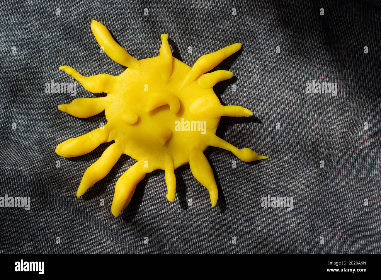 the yellow sun made by plasticine Stock Photo - Alamy