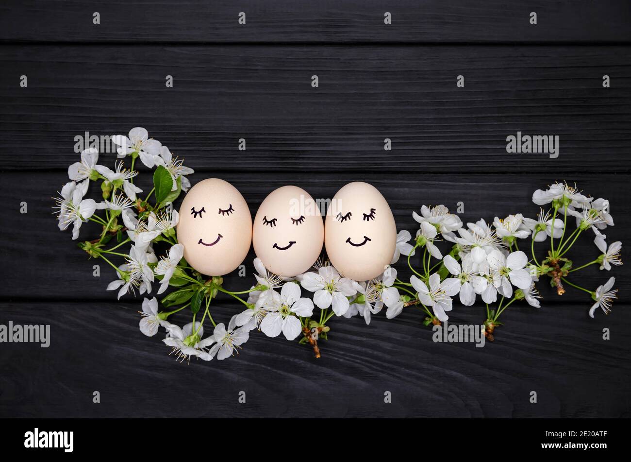 Easter egg with black marker drawn face sleep. Group of sleeping eggs ...
