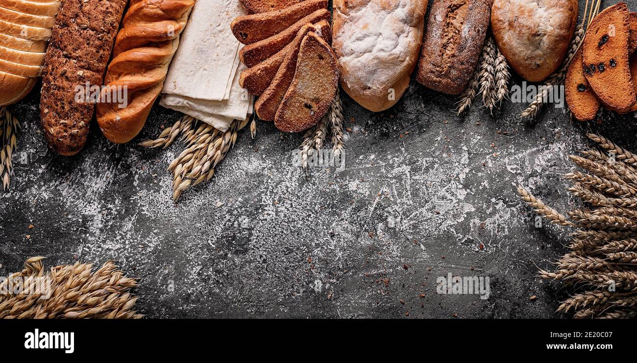 Various types of traditional Italian bread and pastries on a gray ...