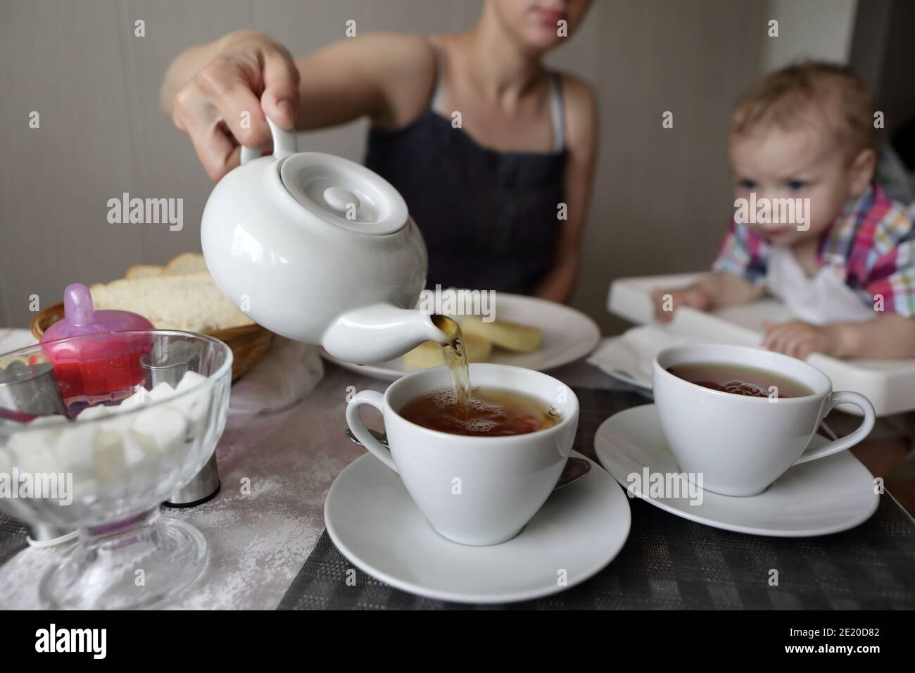 Child eating afternoon tea hi-res stock photography and images - Alamy
