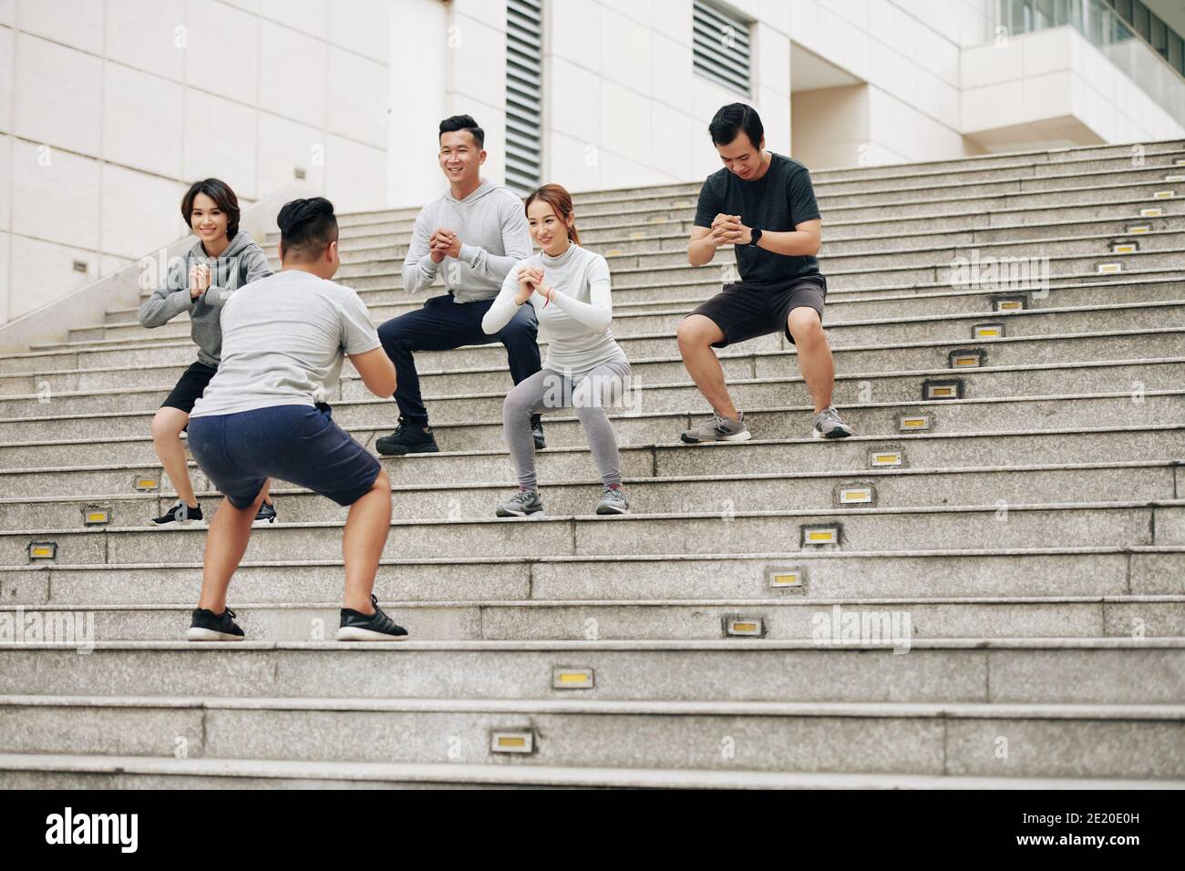 Group people doing exercise city hi-res stock photography and images ...