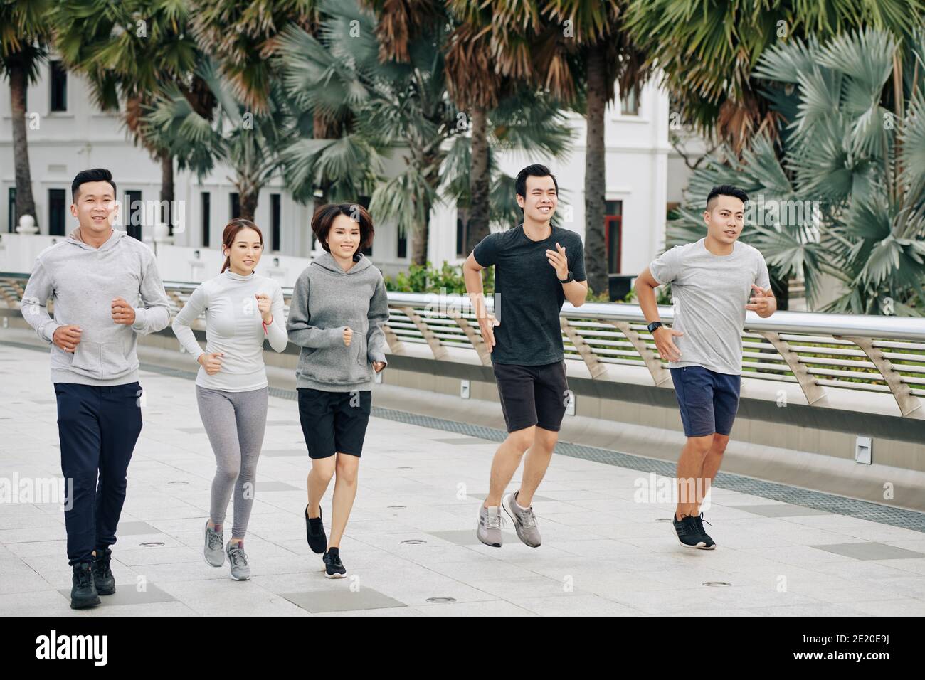 Group people jogging in park hi-res stock photography and images - Alamy