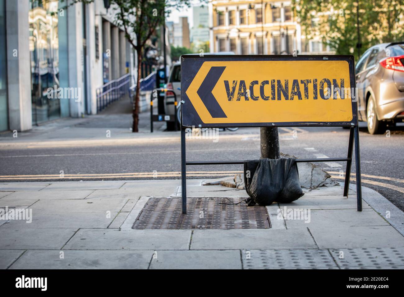 Vaccination sign by the road. Banner for Covid-19 vaccination campaign ...