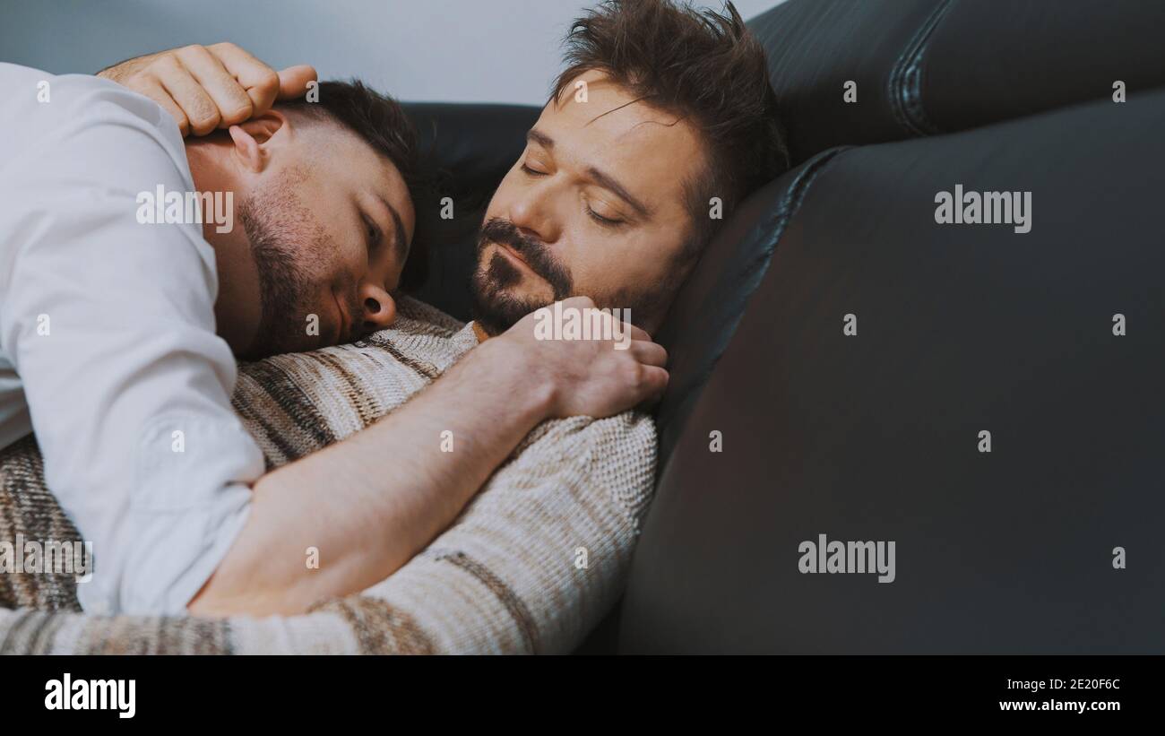 Happy gay couple cuddling on hi-res stock photography and images - Alamy