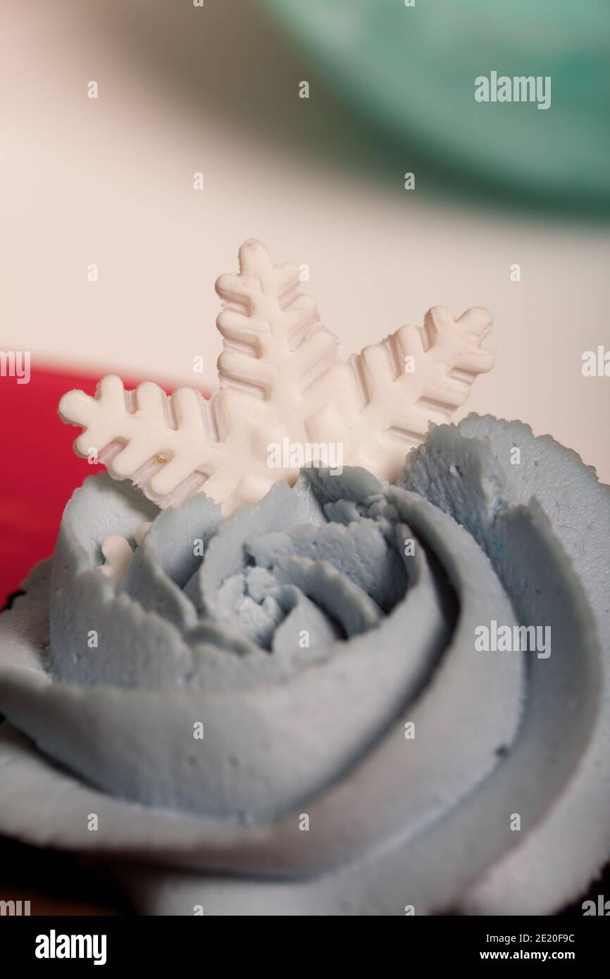 Muffin with cream cheese cream. Decorated with a marshmallow snowflake ...