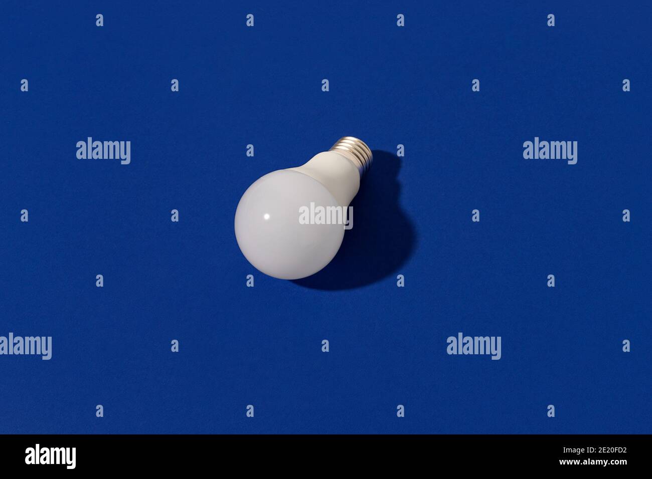 LED energy saving light bulbs on blue background. Sustainable lifestyle ...