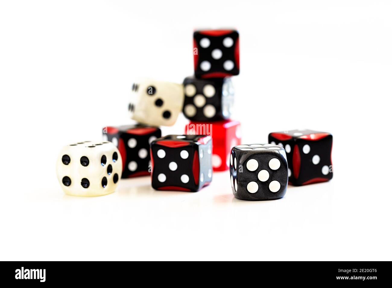 Selection of multi coloured dice isolated on white background with copy ...