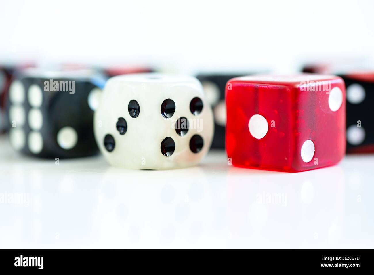 Selection of multi coloured dice isolated on white background with copy ...