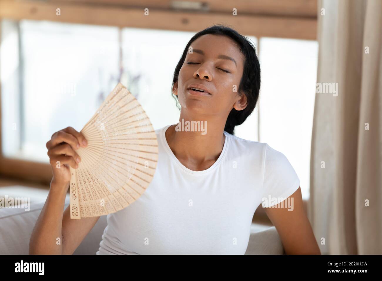 Happy millennial mixed race biracial lady feeling refreshed Stock Photo ...
