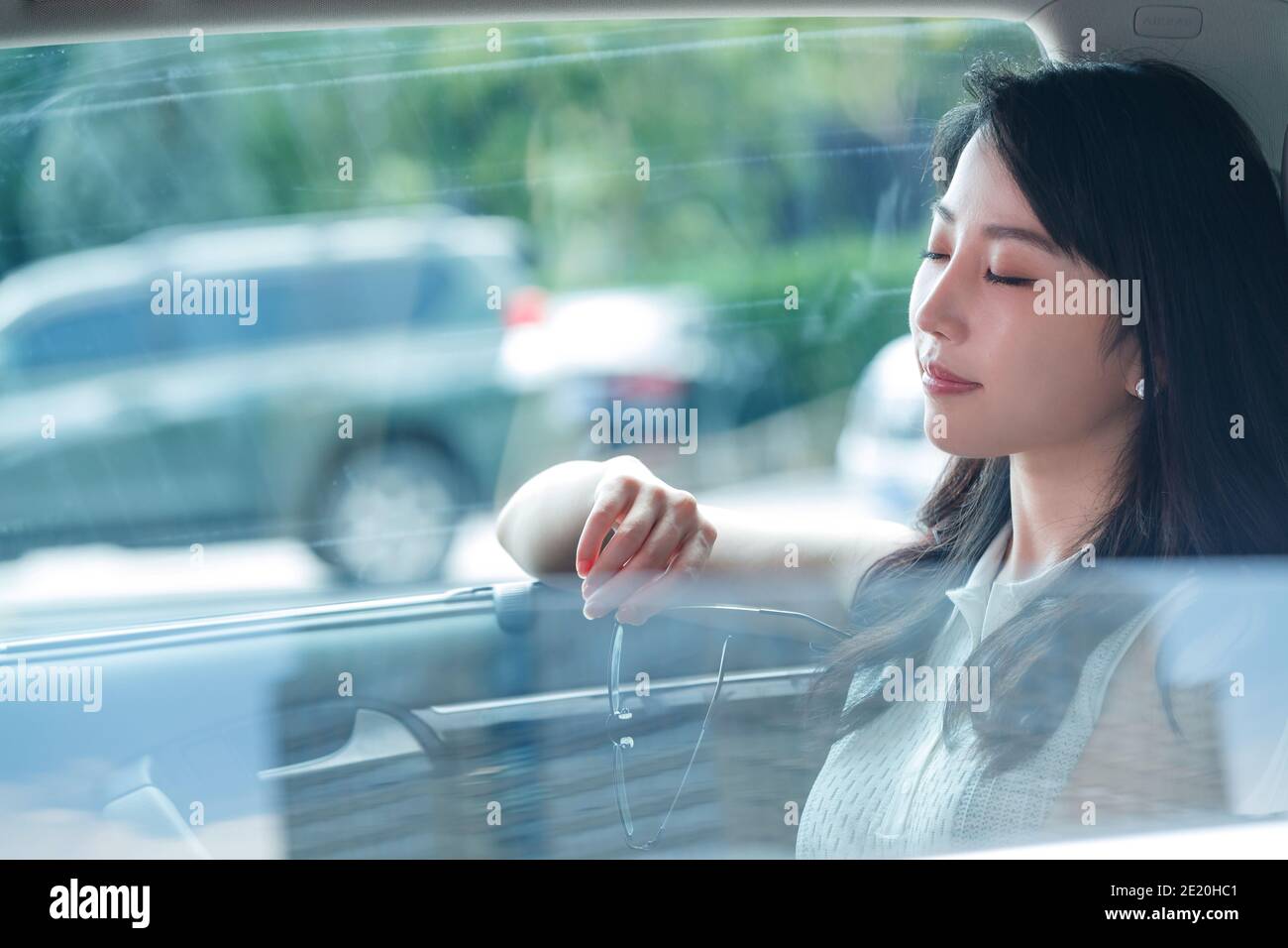 Woman sleeping inside car hi-res stock photography and images - Alamy
