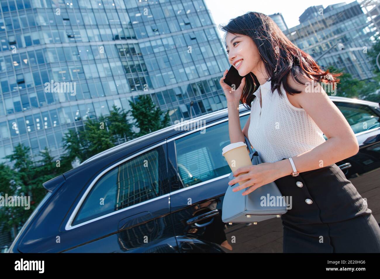 Indian women in car looking at phone hi-res stock photography and ...