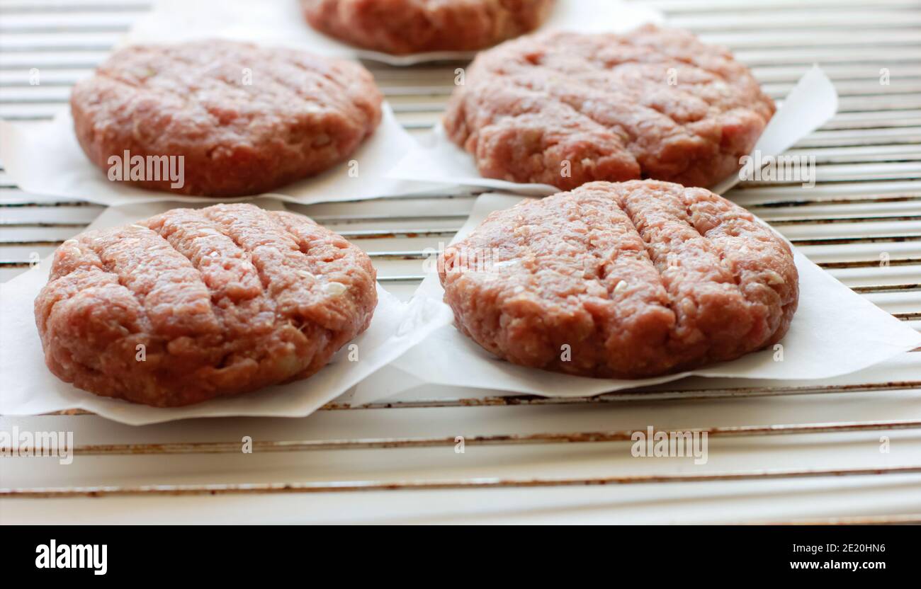 Plant based meat concept. Vegetable burger patties on grille. First non ...