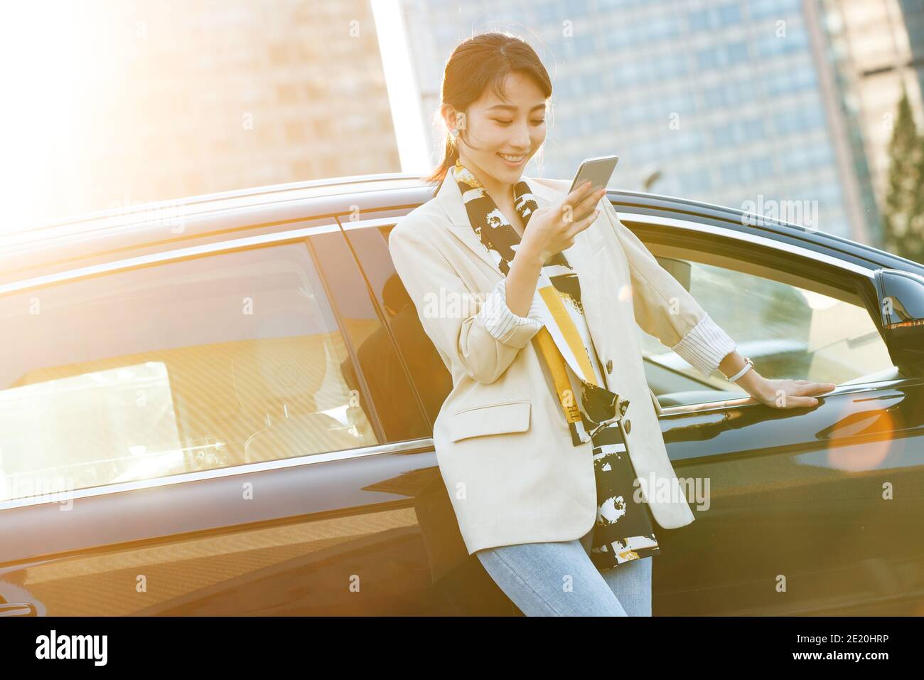 Urban white-collar car cell phone use Stock Photo - Alamy