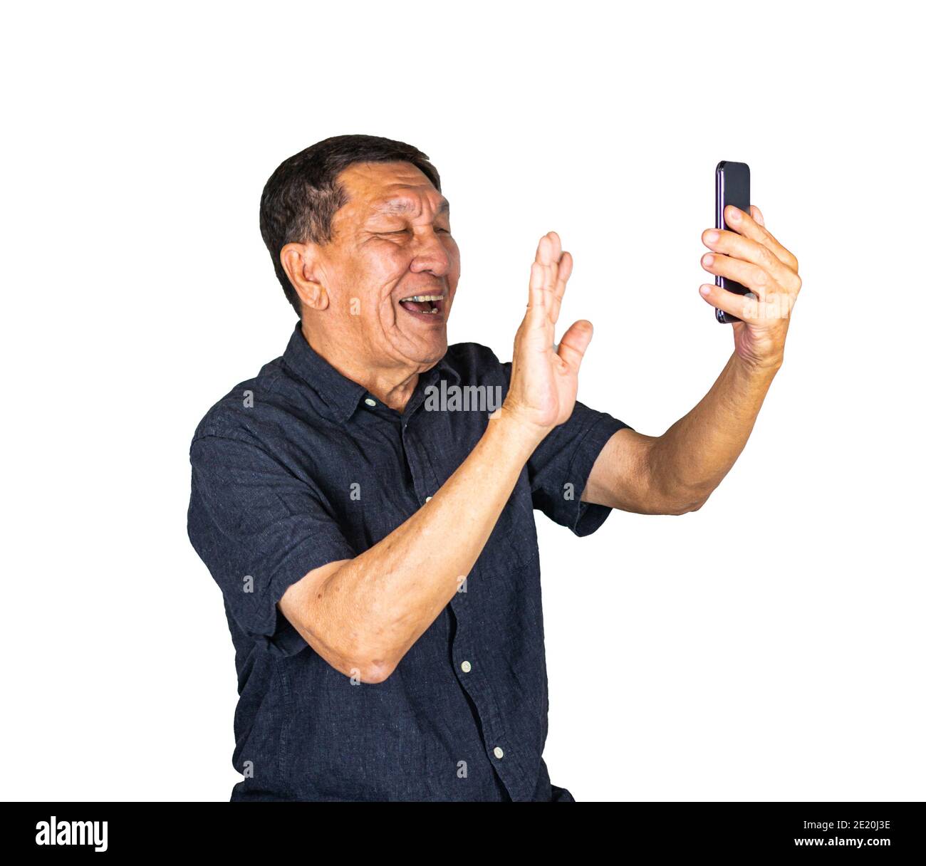 Senior man video calling on smart phone isolated on white background ...
