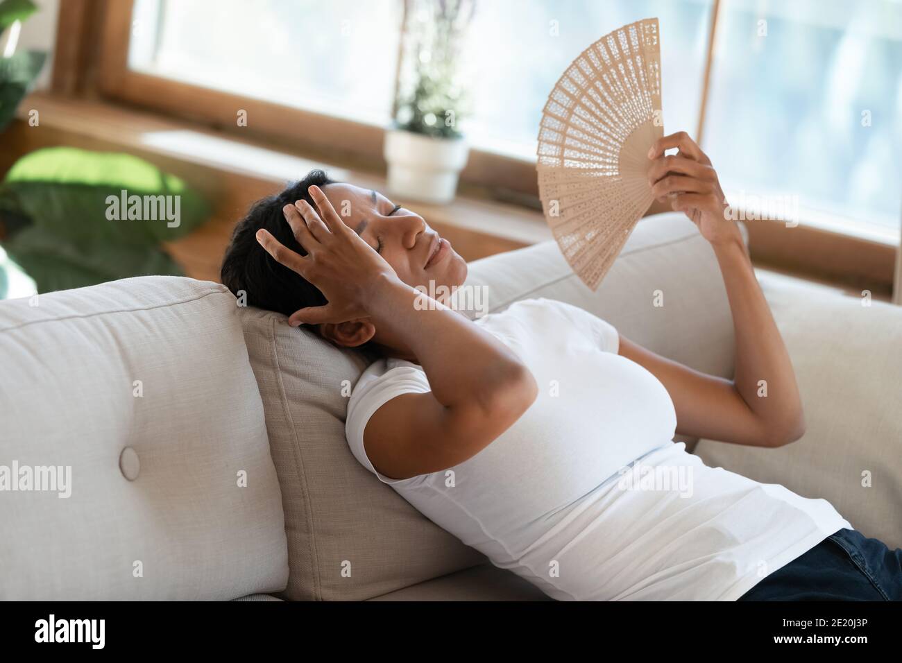 Woman Fanning Herself High Resolution Stock Photography and Images - Alamy